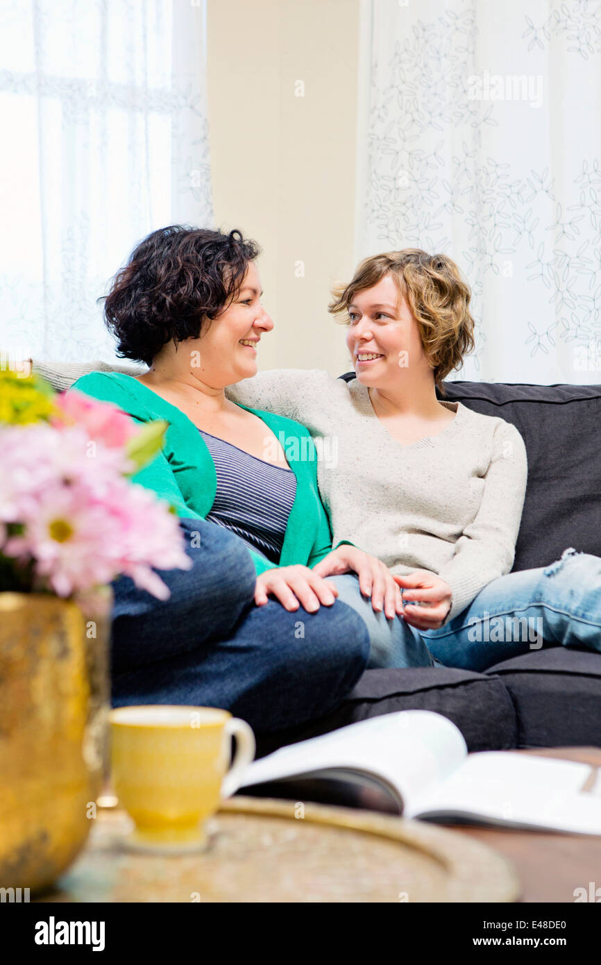 Couple sitting side by side at table hi-res stock photography and ...