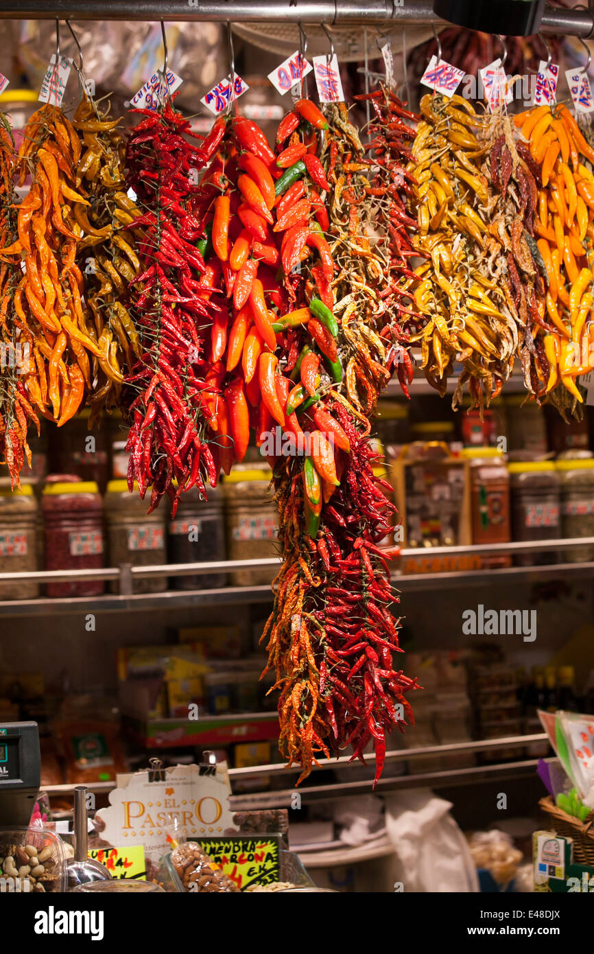 Chillies hanging in market Stock Photo - Alamy