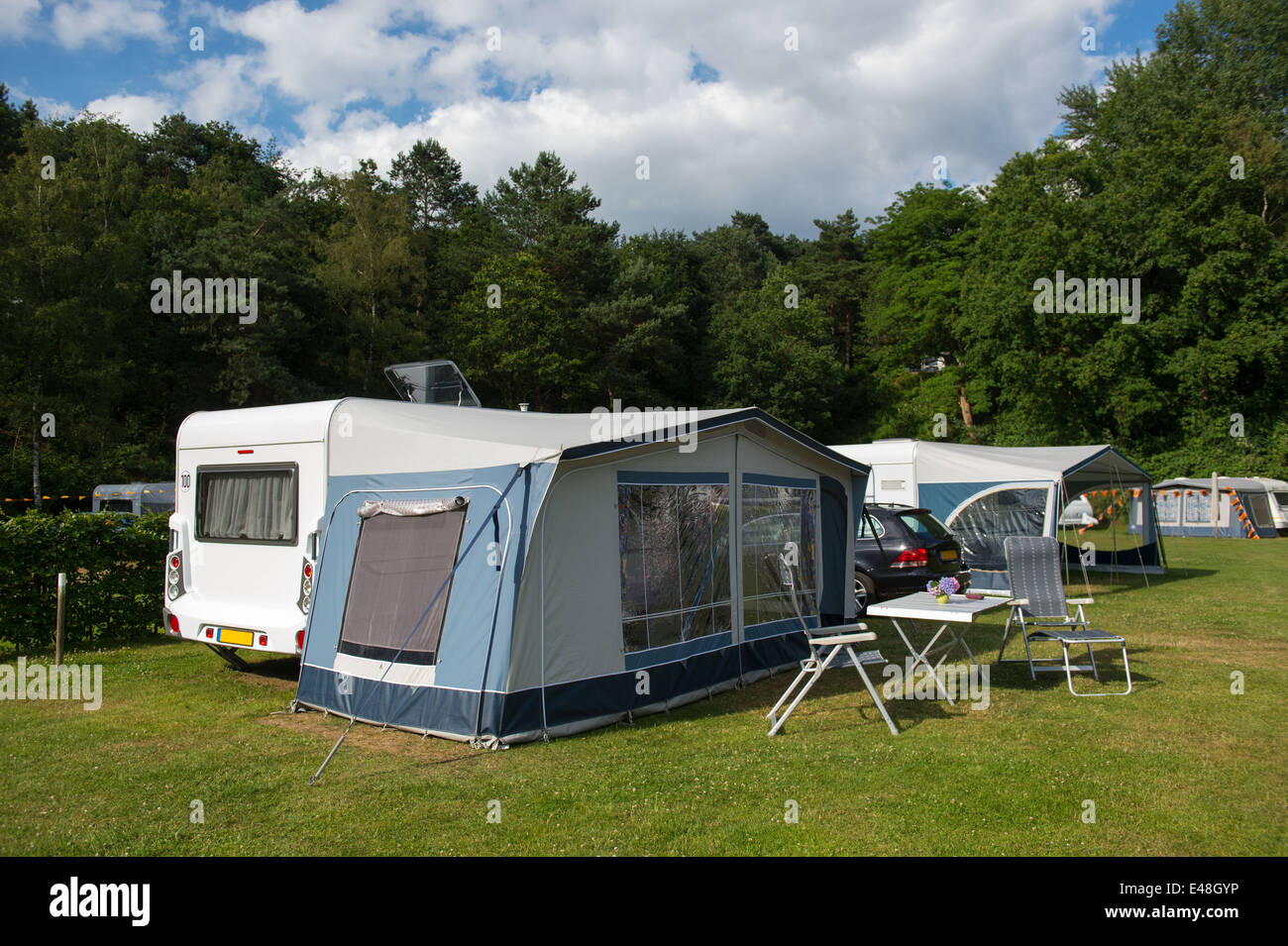 Camping with caravan and shelter in nature Stock Photo - Alamy