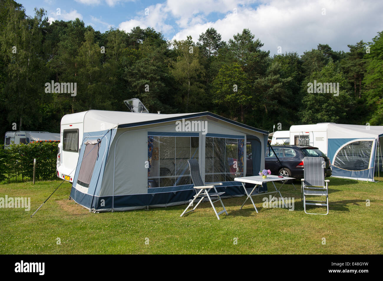 Camping with caravan and shelter in nature Stock Photo - Alamy
