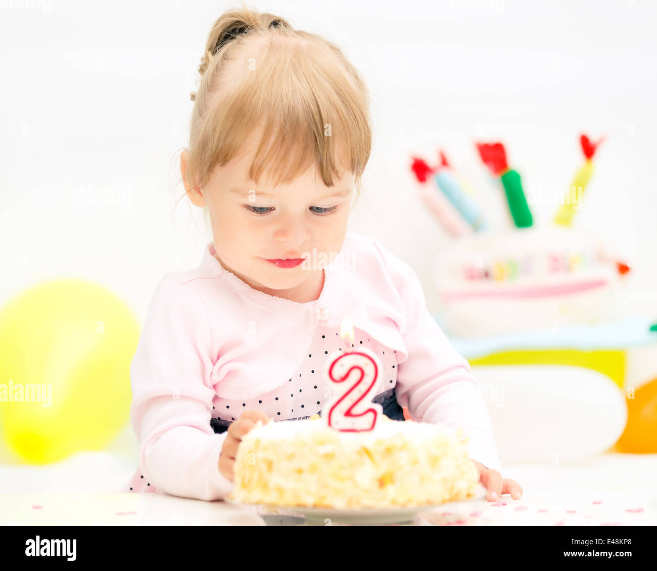 Little girl celebrating second birthday Stock Photo - Alamy