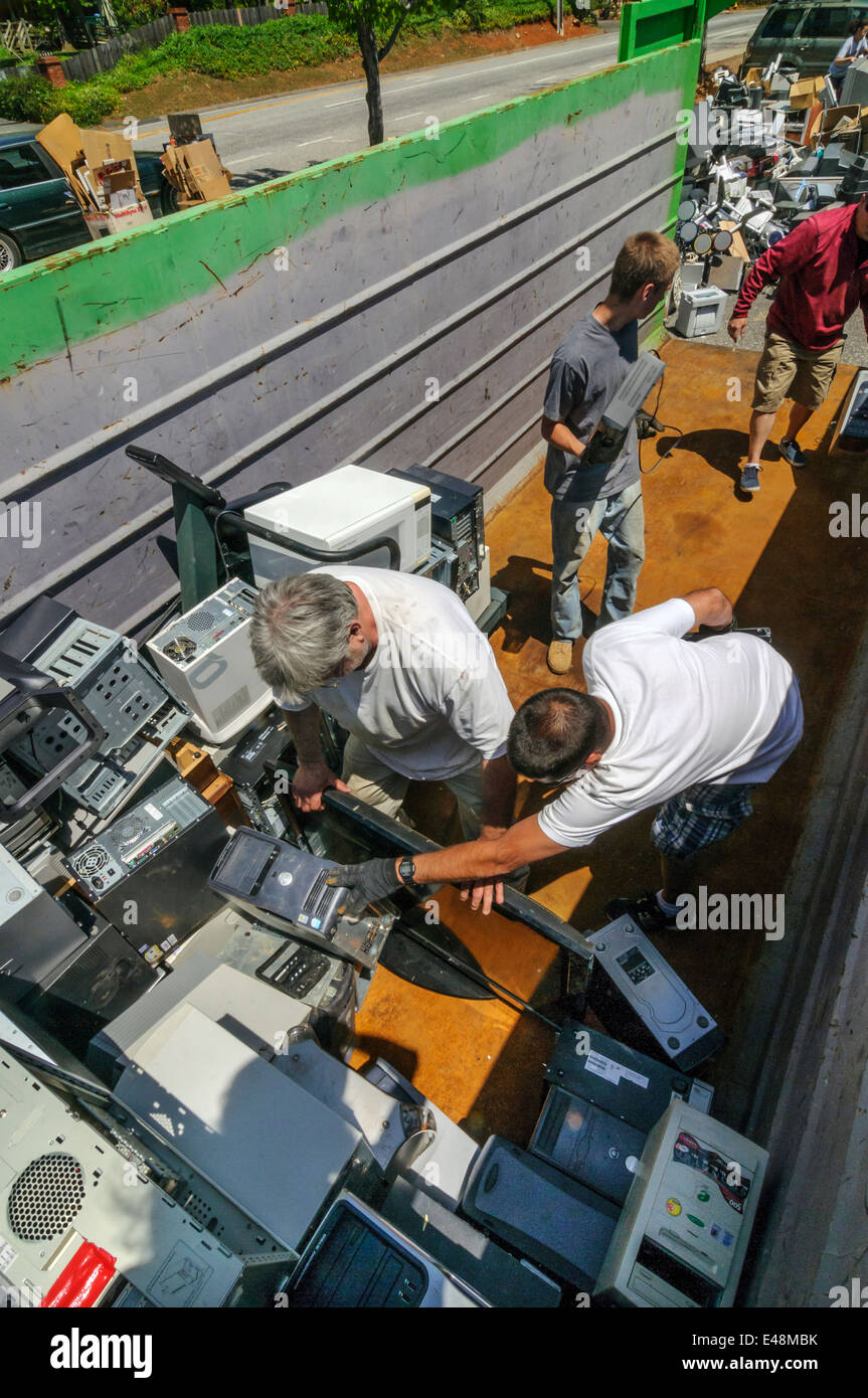 Volunteers helping at electronic waste collection - community ...