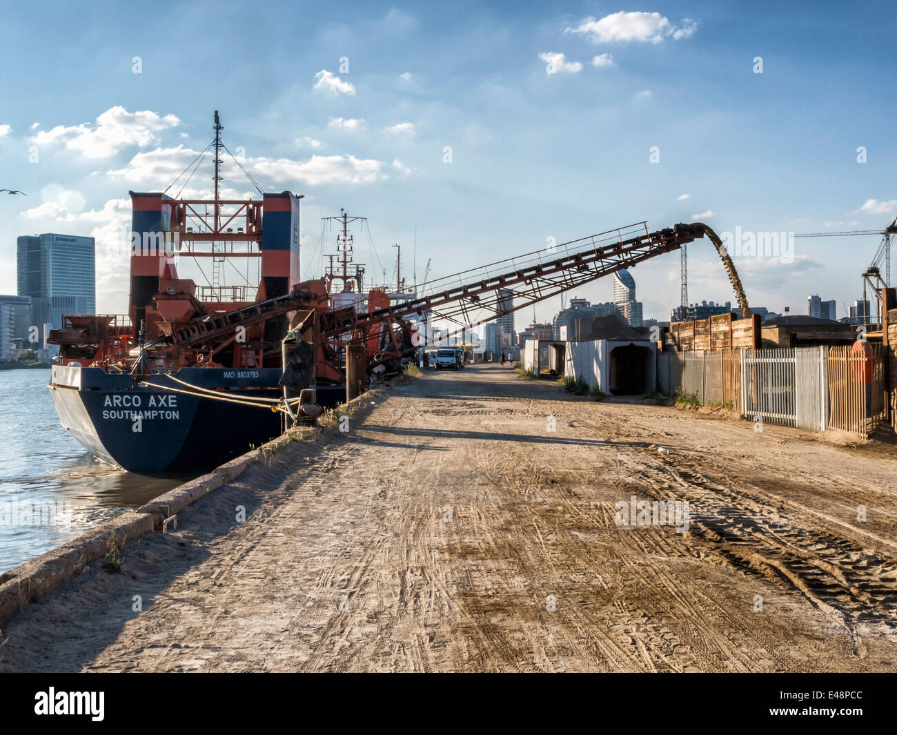Arco Axe suction dredger dredging soil from Thames riverbed at building ...