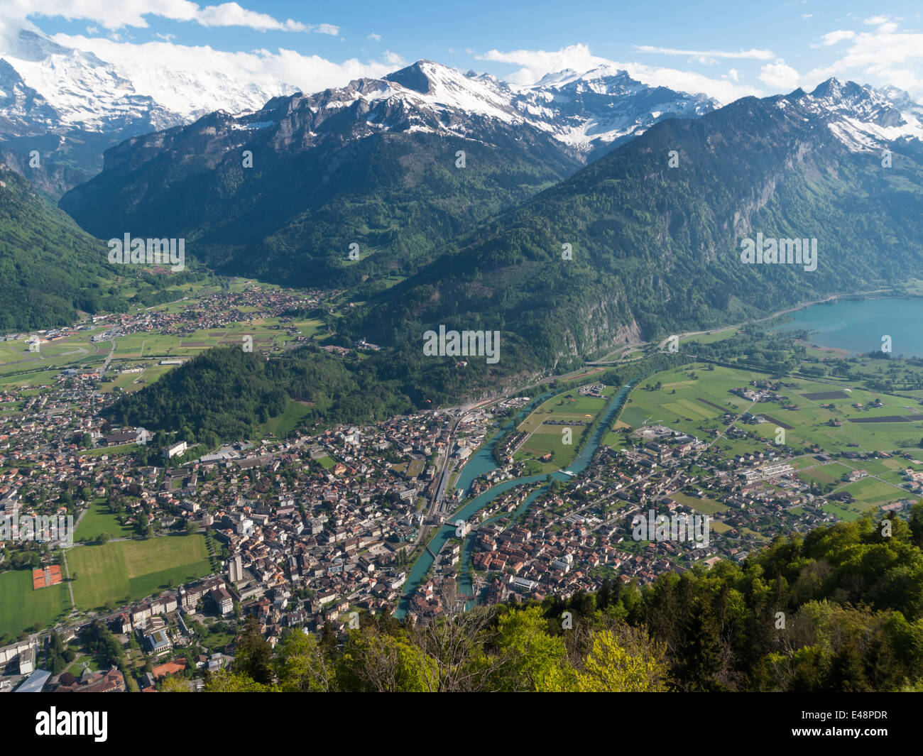 City of Interlaken (Switzerland), lake Thun and the alpine mountains of ...