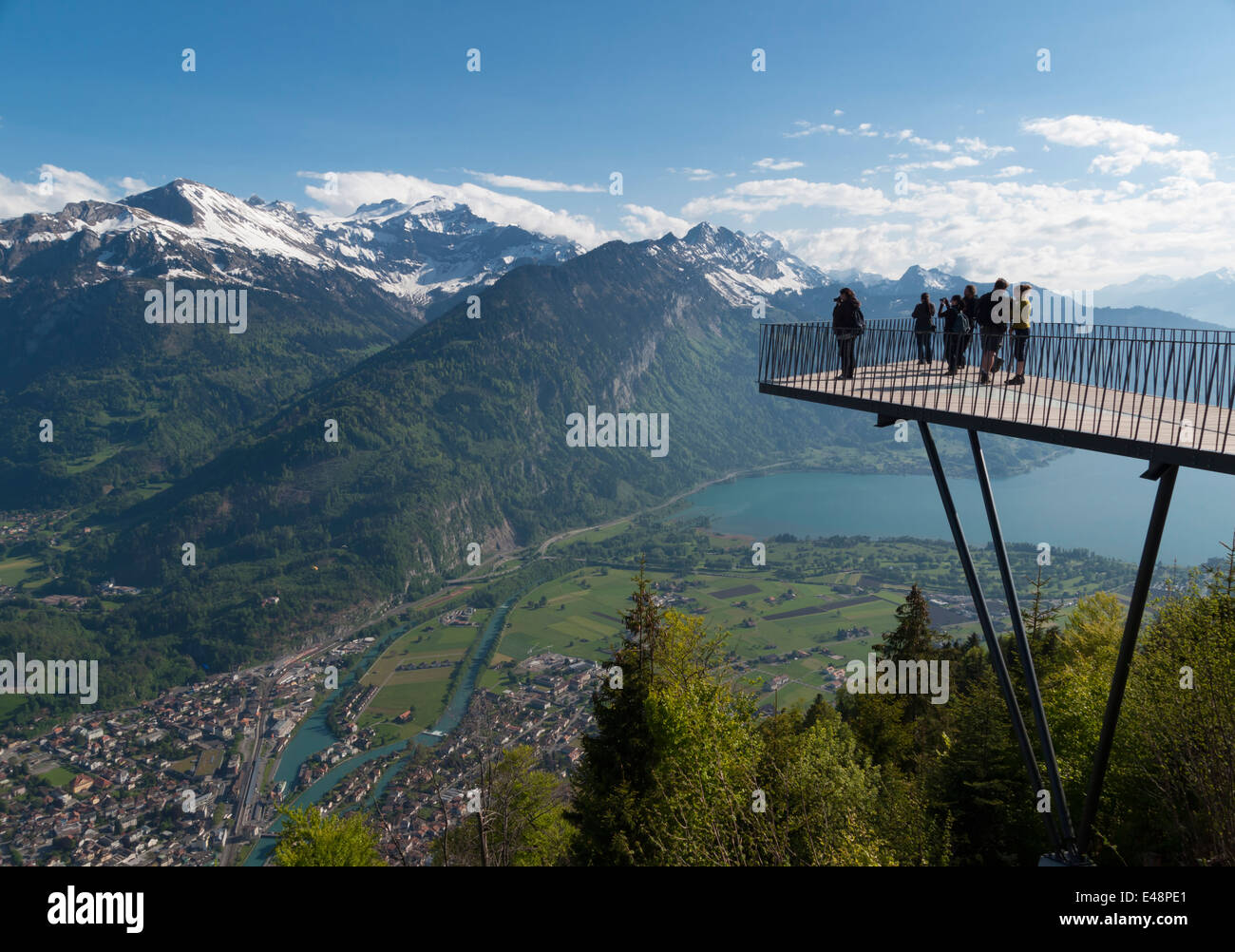 Tourists are gathering on a viewpoint at Harder Kulm to take a look at ...