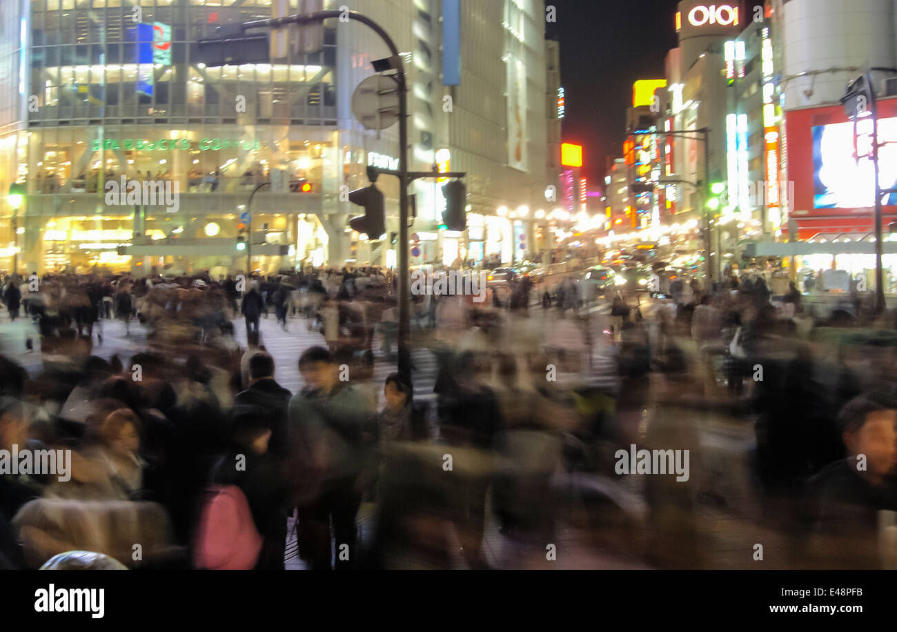 Pedestrians are crossing the Shibuya crossroads in Tokyo, Japan, at ...