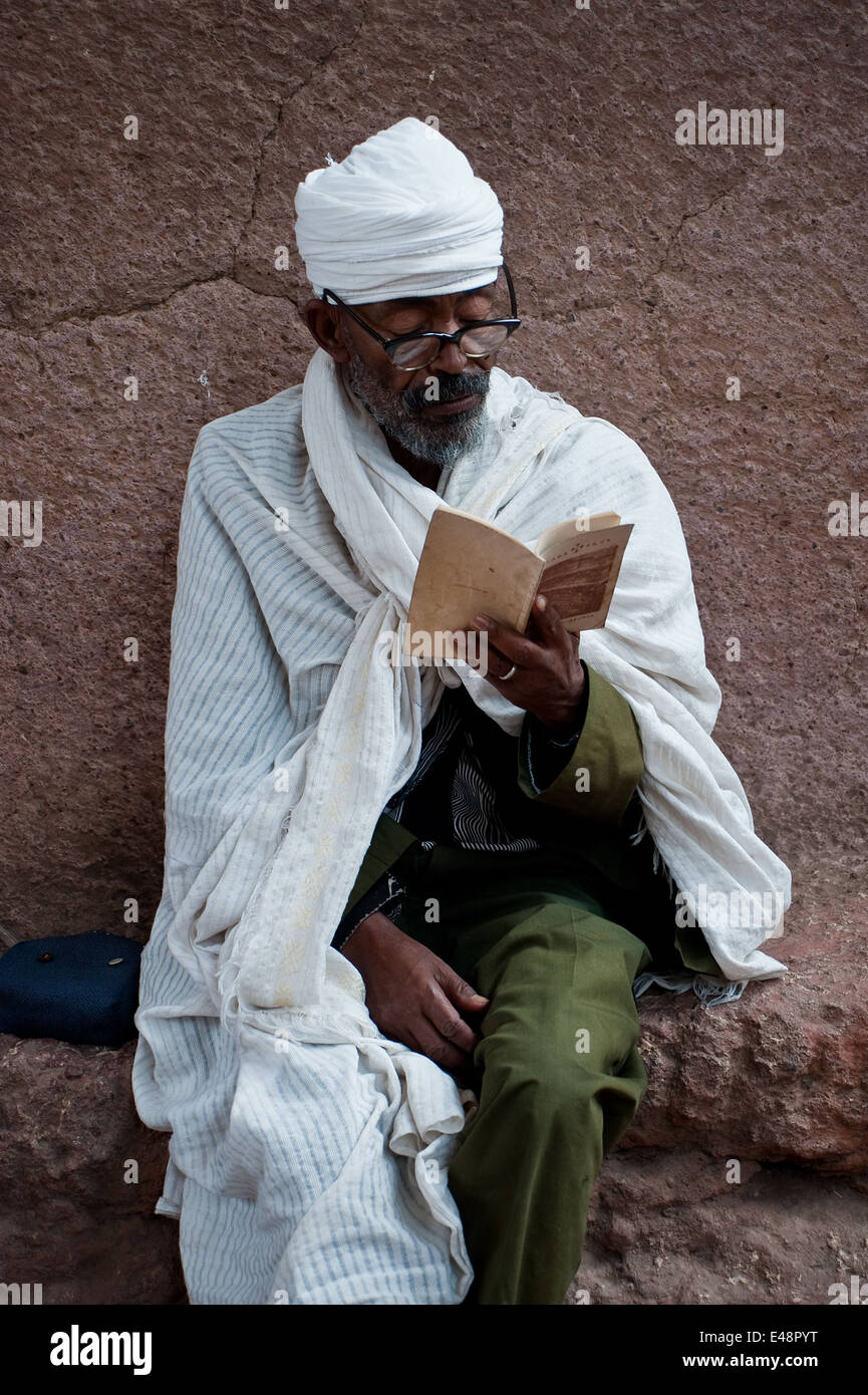 Orthodox man reading a religious book ( Ethiopia Stock Photo - Alamy