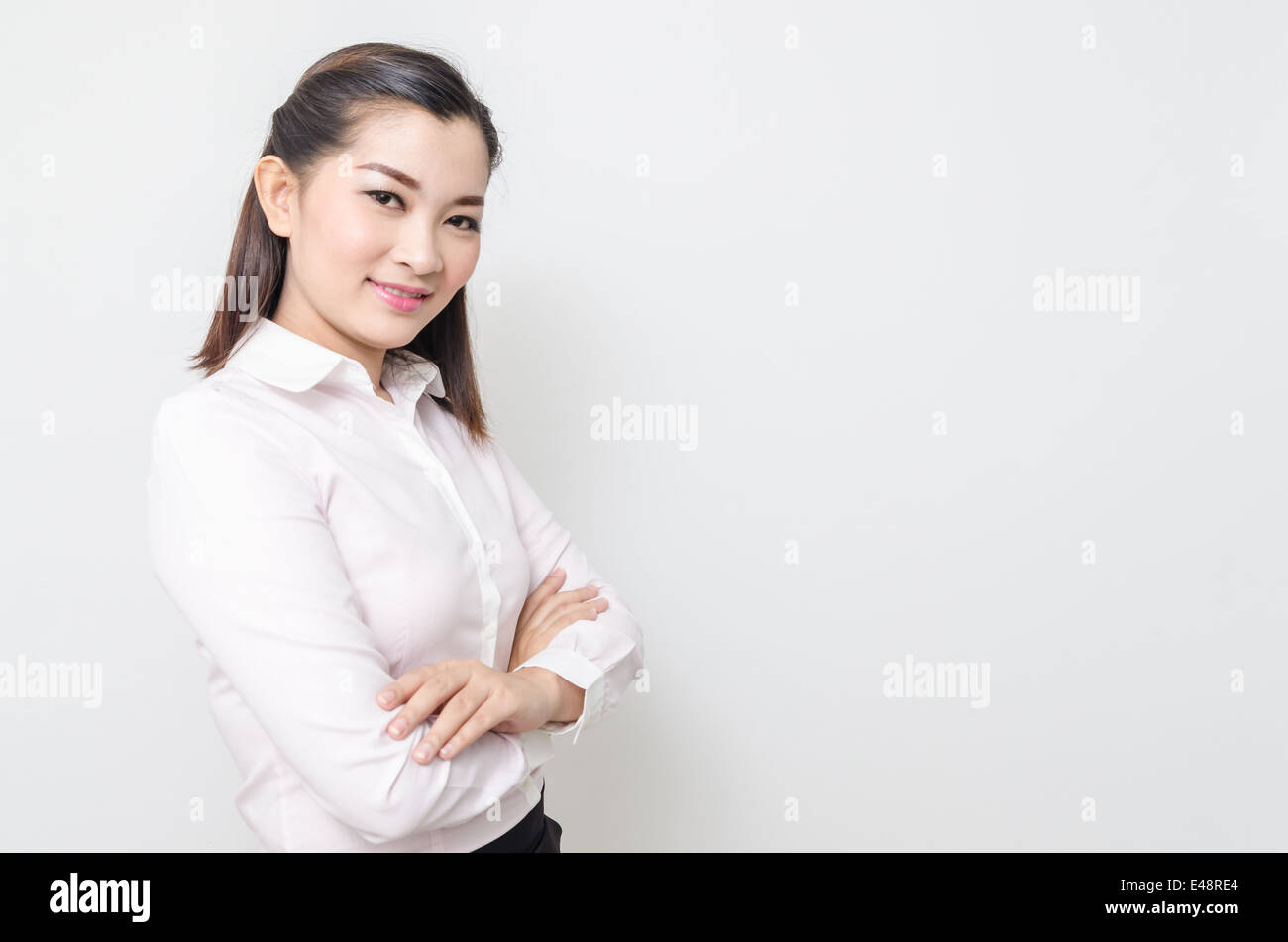 Portrait of smiling business woman, isolated on white background ...