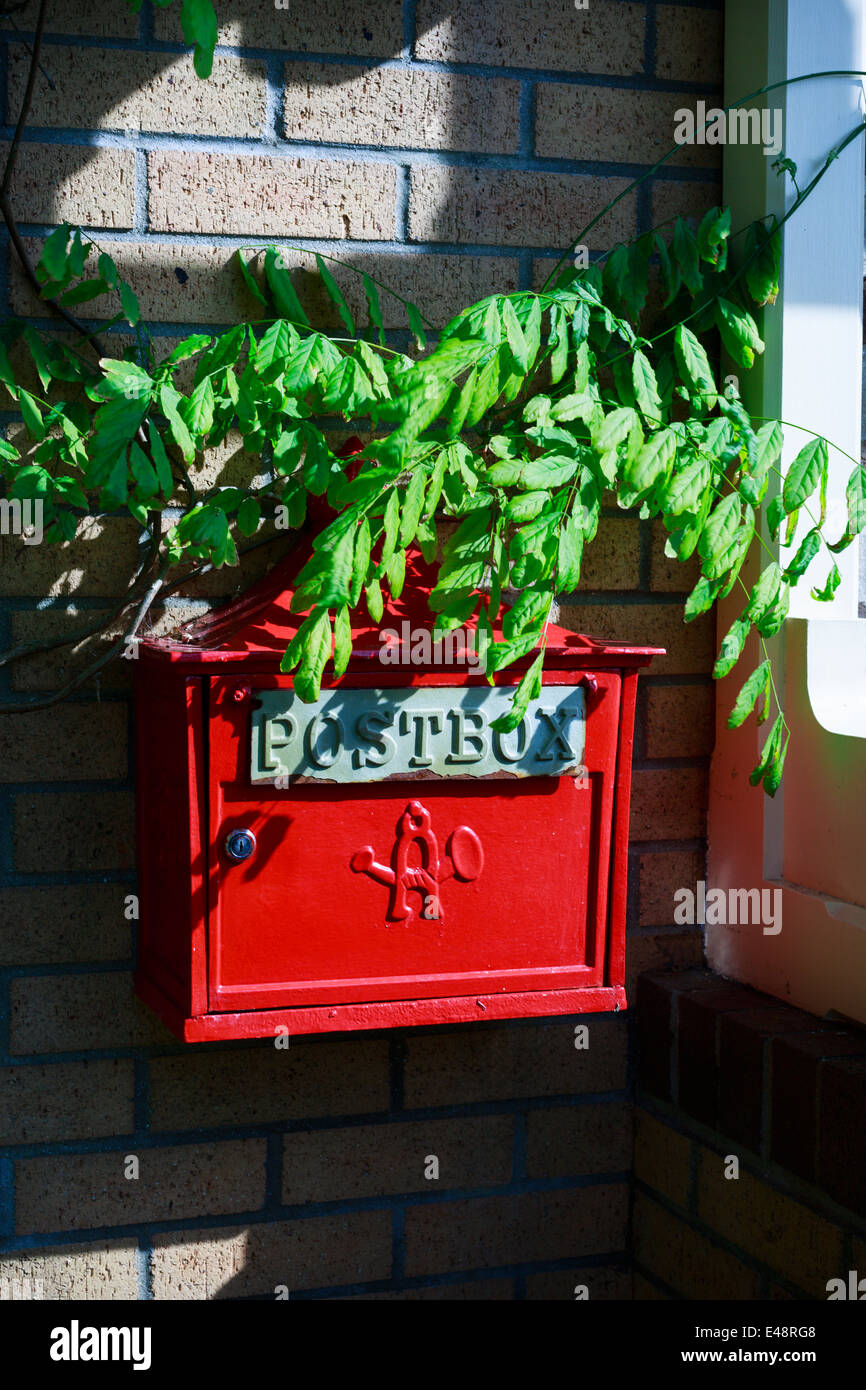 red post box fitted to house Stock Photo - Alamy