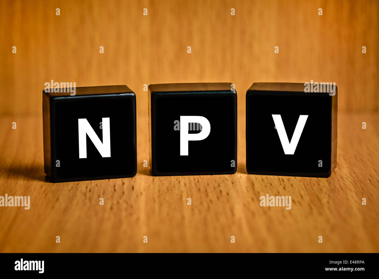 NPV or net present value text on black block Stock Photo - Alamy