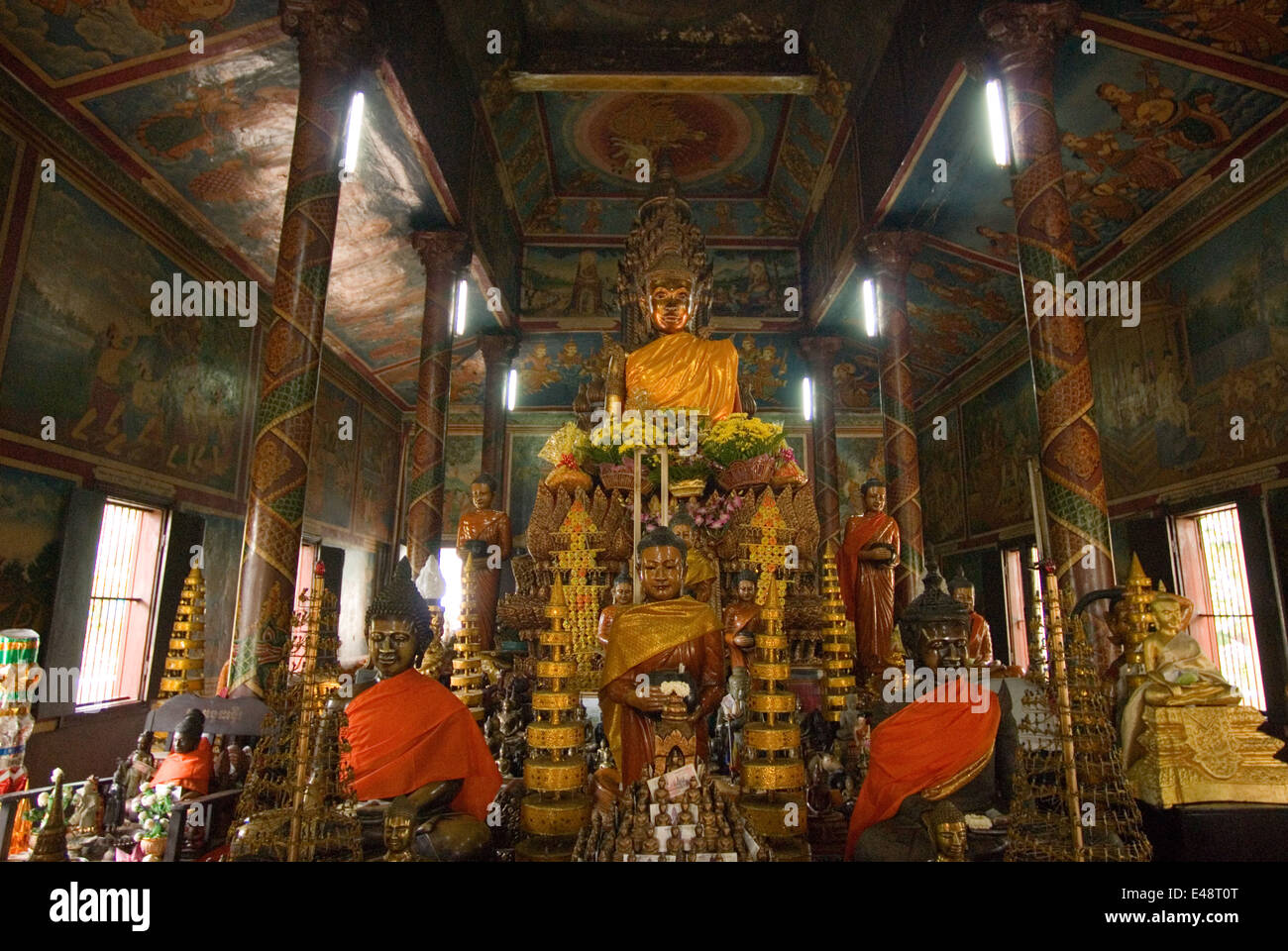 Inside Wat Phnom, Phnom Penh, Cambodia. Candles and Buddha statue in ...