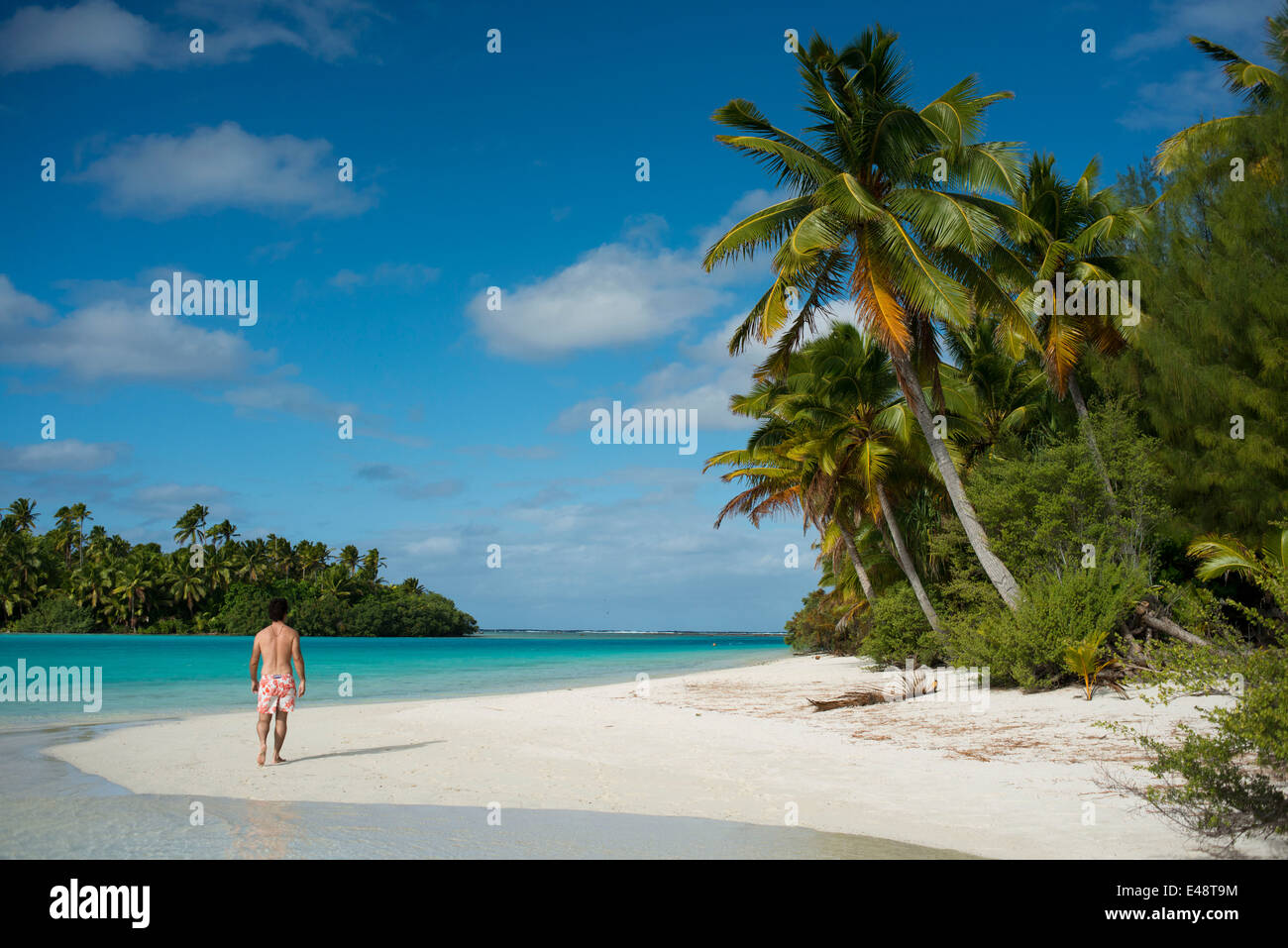 Aitutaki. Cook Island. Polynesia. South Pacific Ocean. A tourist walks ...