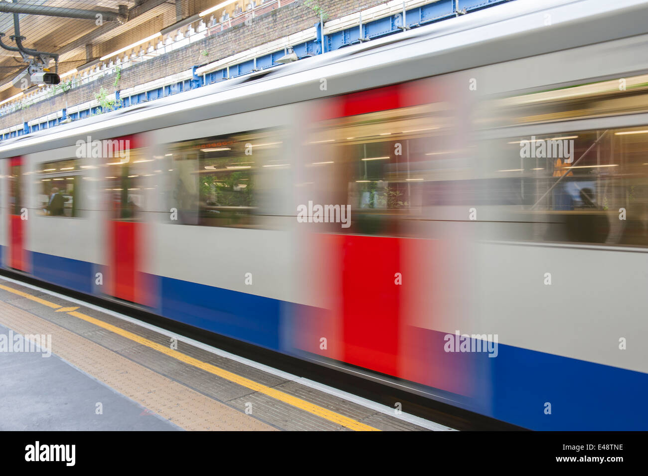 Abstract motion blur of train traveling through a station Stock Photo ...