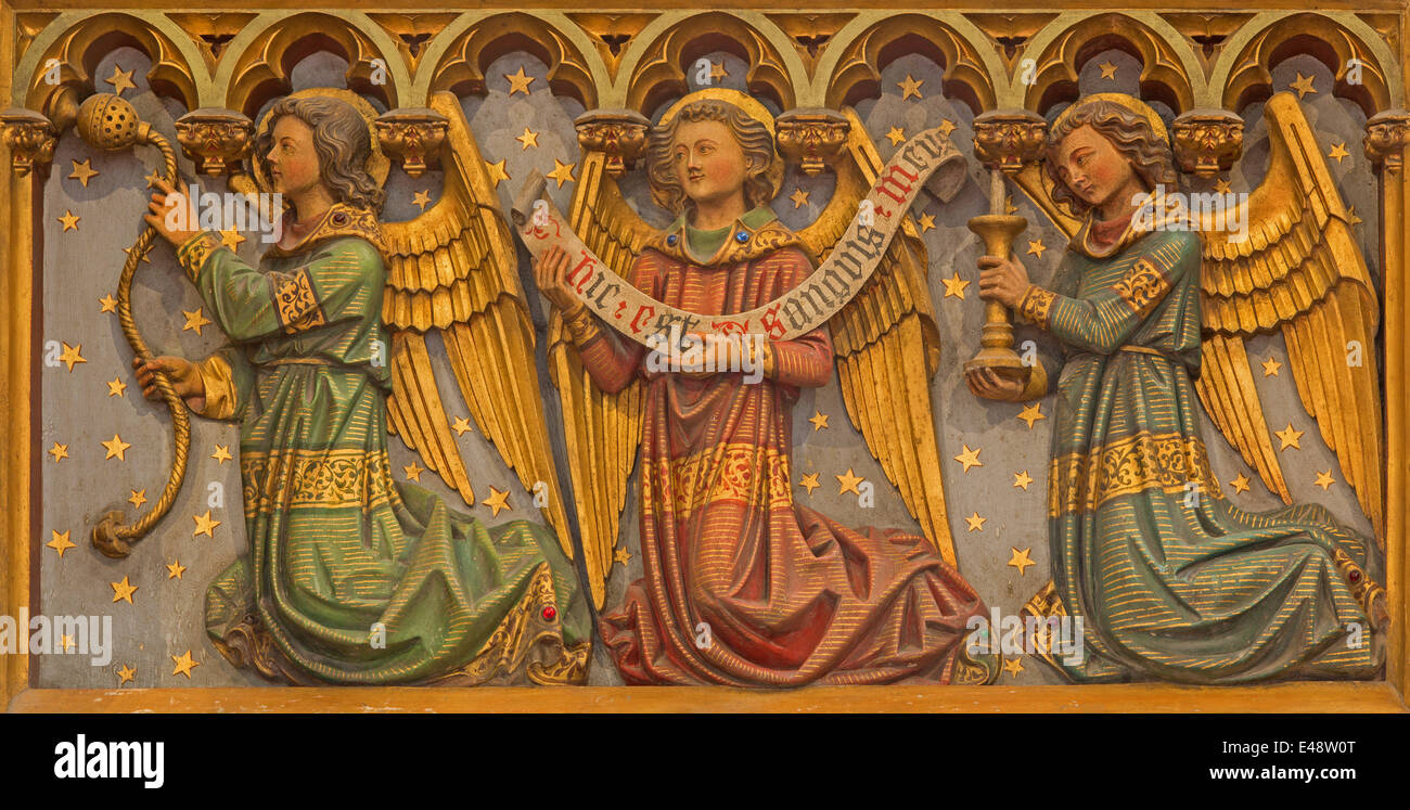 BRUGES, BELGIUM - JUNE 12, 2014: The Carved neogothic relief of angels ...