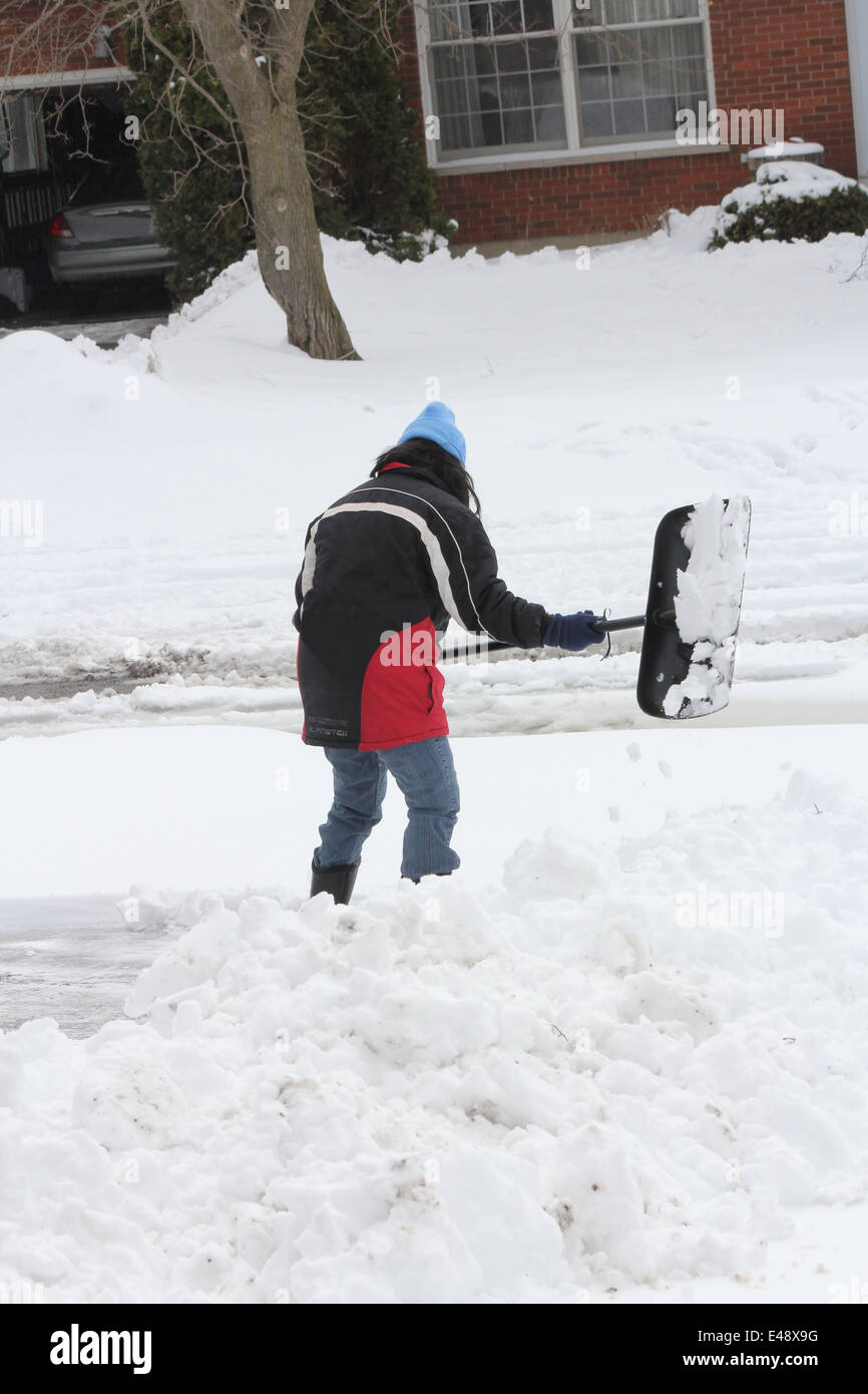 Woman shoveling snow shovel hi-res stock photography and images - Alamy