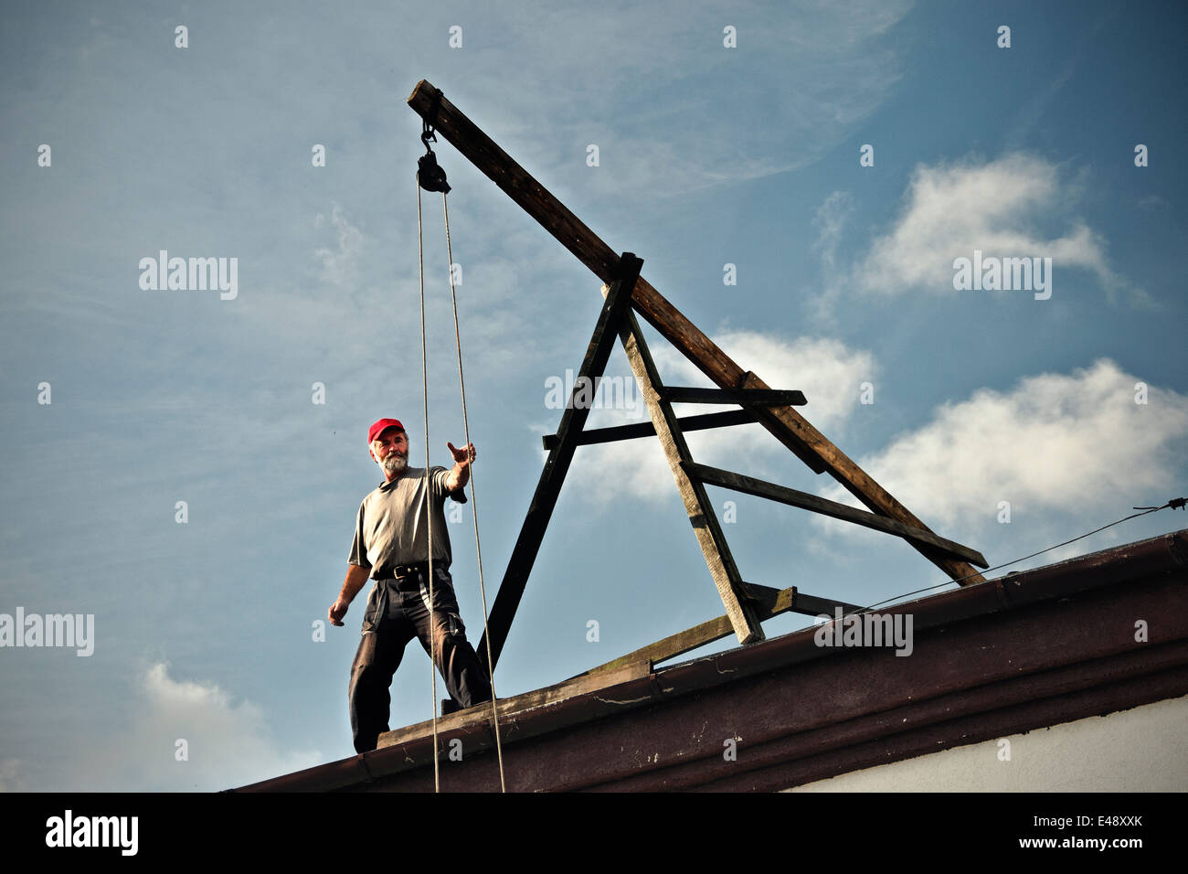 Man on roof hi-res stock photography and images - Alamy
