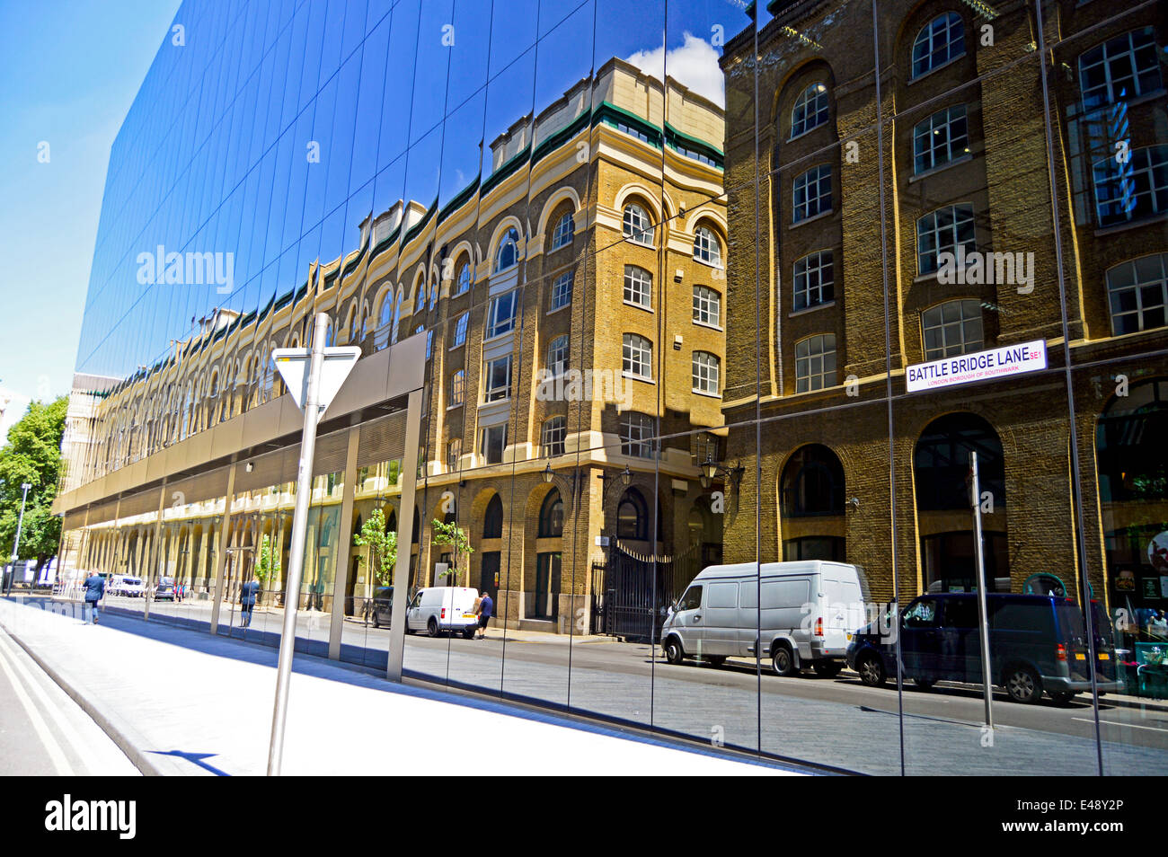 Modern glass building on Battle Bridge Lane showing reflections, London ...