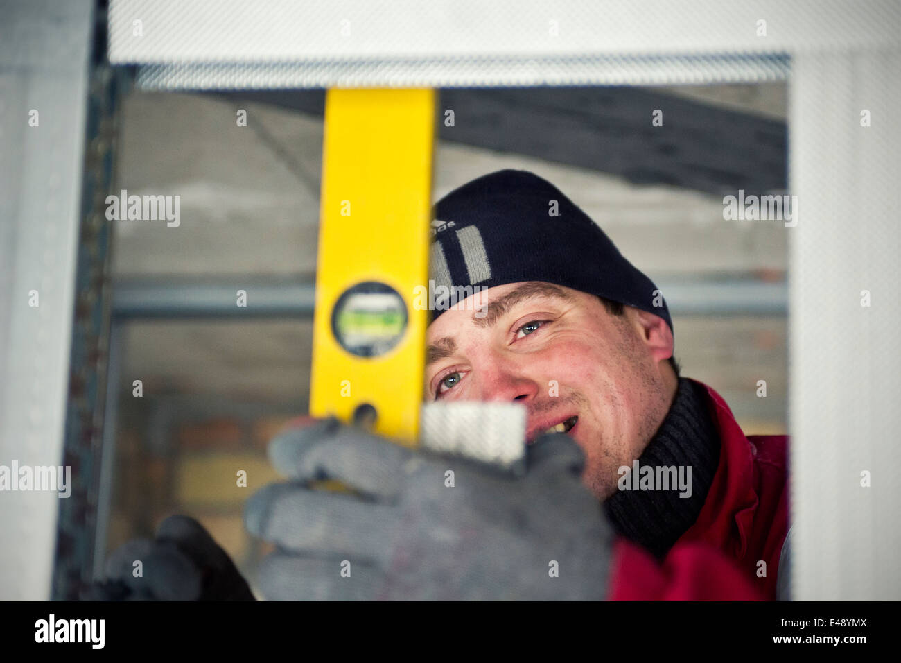 Man at work checking level Stock Photo - Alamy