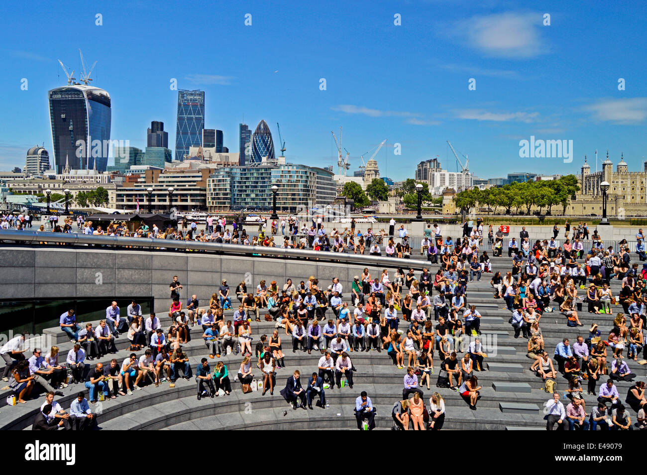 Group of office workers during lunchtime at More London Riverside ...