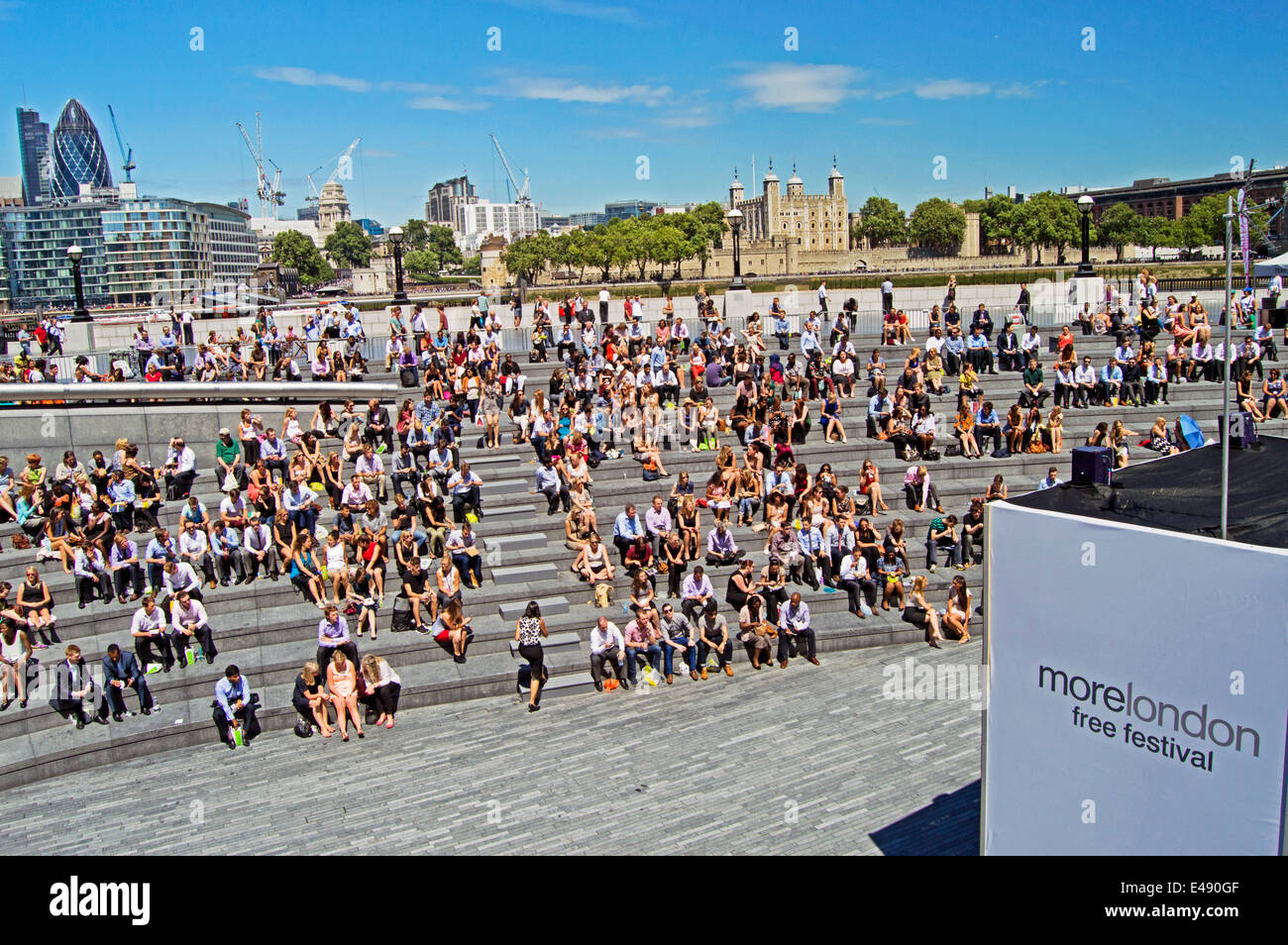 Group of office workers during lunchtime at More London Riverside ...
