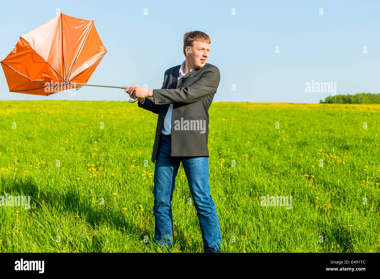 Strong wind umbrella hi-res stock photography and images - Alamy