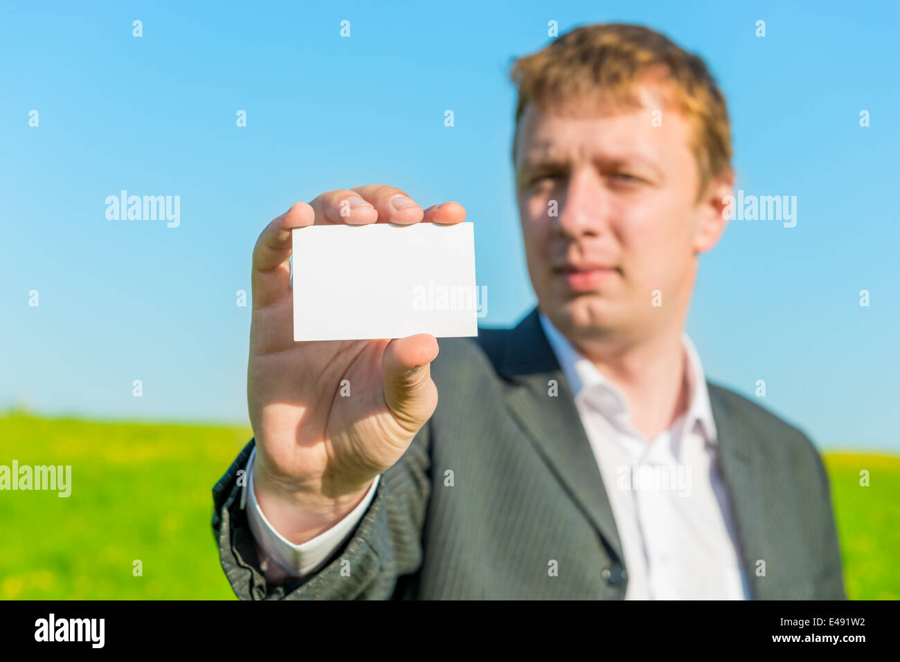 Businessman showing blank business card hi-res stock photography and ...