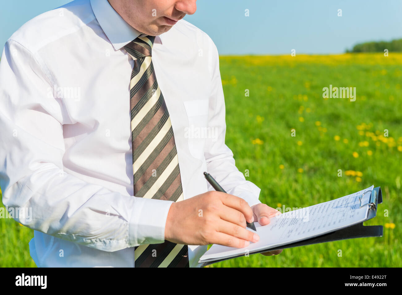 Director puts his signature on important documents Stock Photo - Alamy