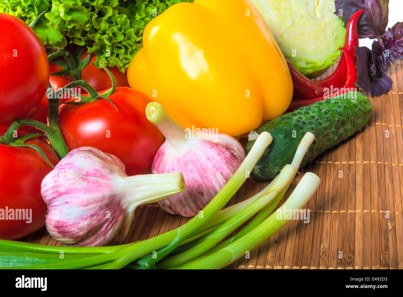 a bunch of healthy vegetables on a wooden napkin Stock Photo - Alamy