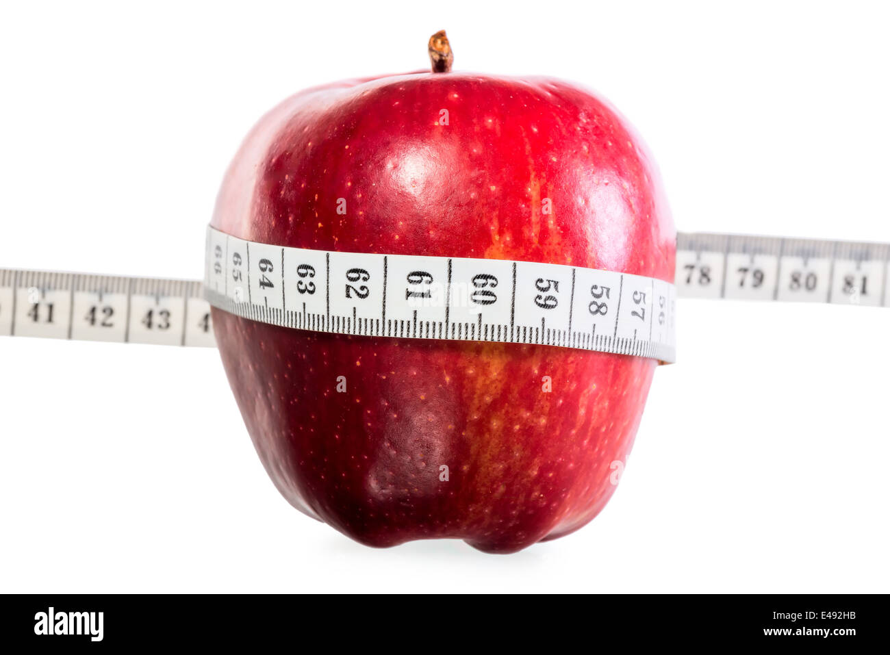 red ripe apple with a measuring tape on a white background Stock Photo ...
