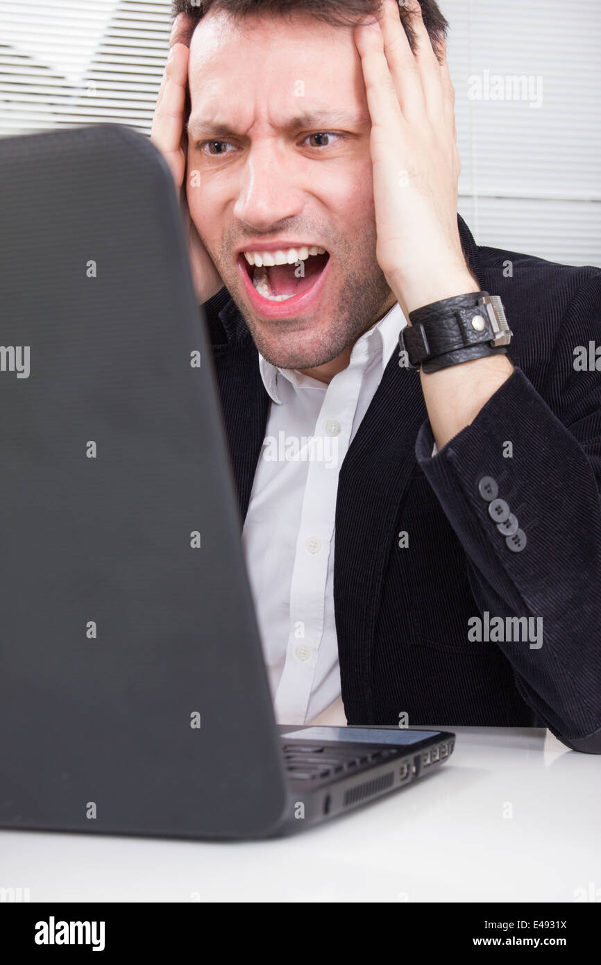 business man working and having problem with using laptop looking at ...