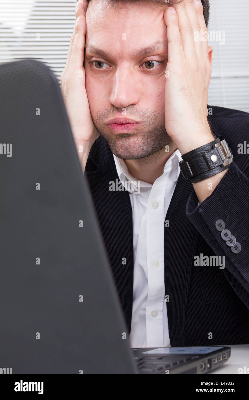 business man working and having problem with using laptop looking at ...