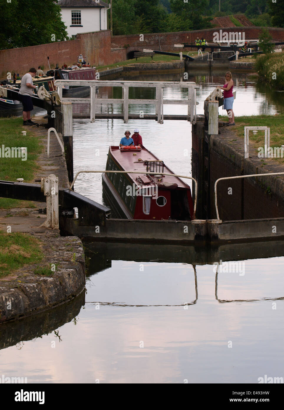 Narrow boat entering a lock on the Caen Hill Locks on the Kennet and ...