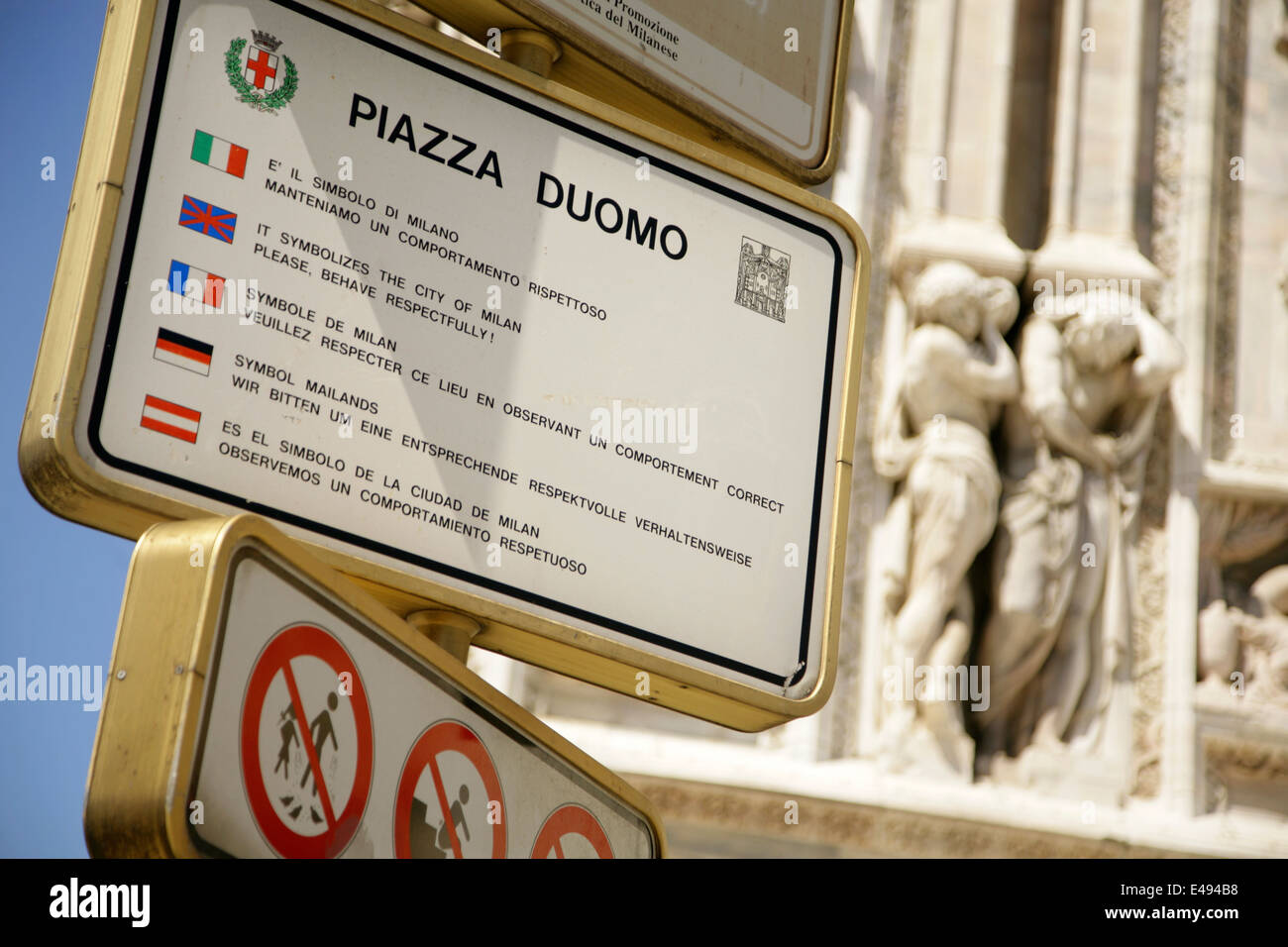 Sign on Piazza Duomo, Milan, Italy asking visitors to behave ...