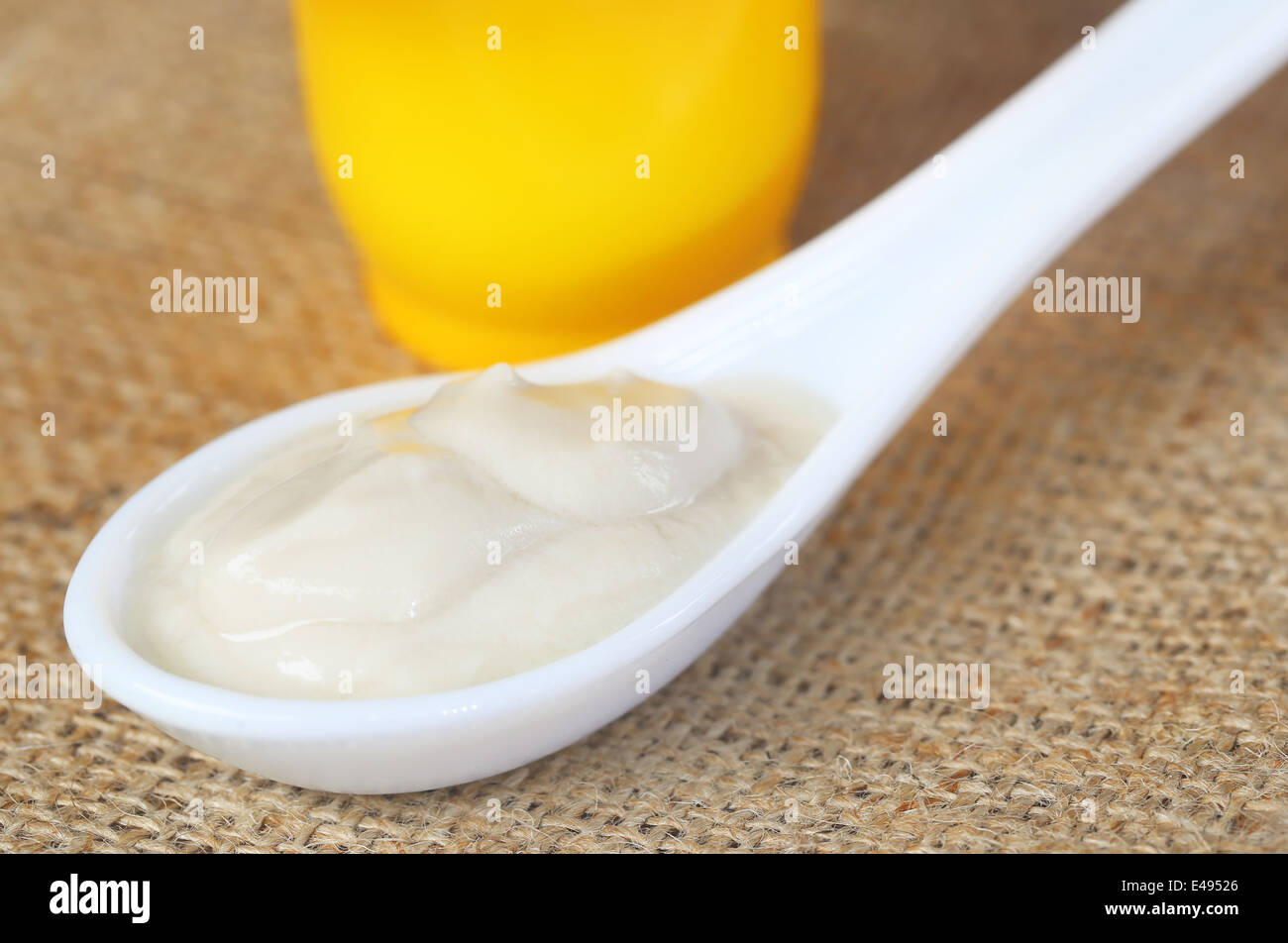 Yogurt or sweet curd on white spoon Stock Photo - Alamy