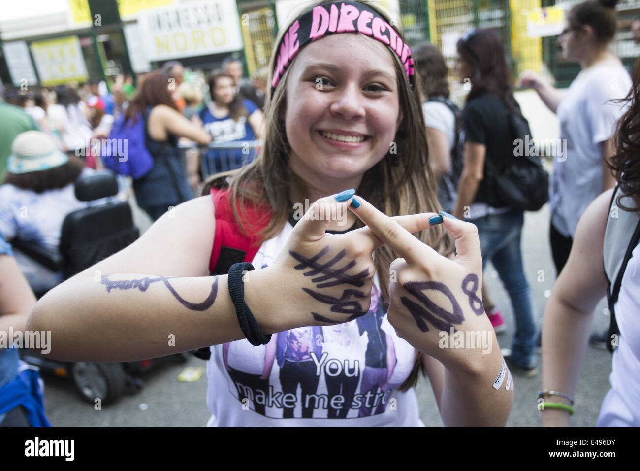 Turin, Italy. 6th July, 2014. One Direction's fans standing at Olympic ...