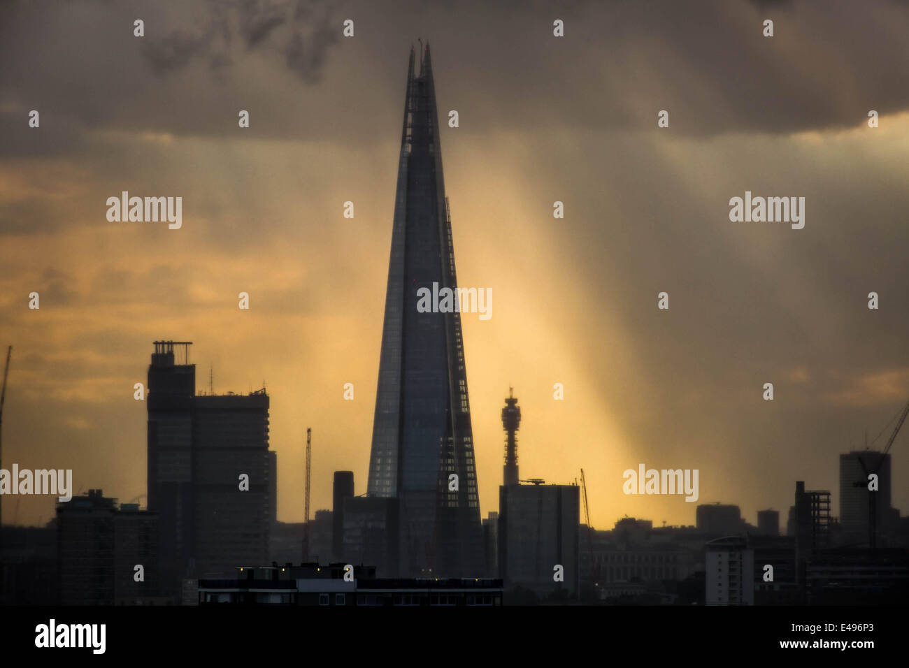 London, UK. 06th July, 2014. Dramatic rainstorm over The Shard Building ...