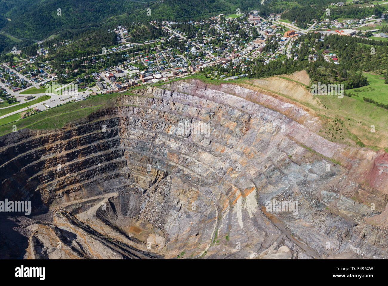 aerial view of an abandoned open pit mine and the town of Lead, South ...