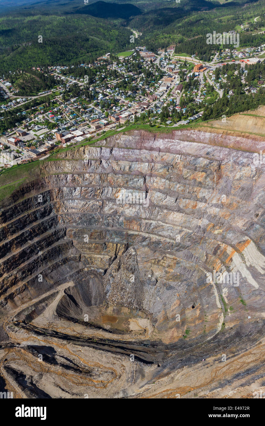 aerial view of an abandoned open pit mine and the town of Lead, South ...
