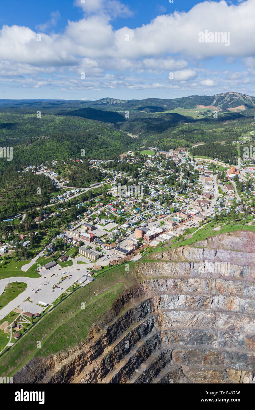 aerial view of an abandoned open pit mine and the town of Lead, South ...