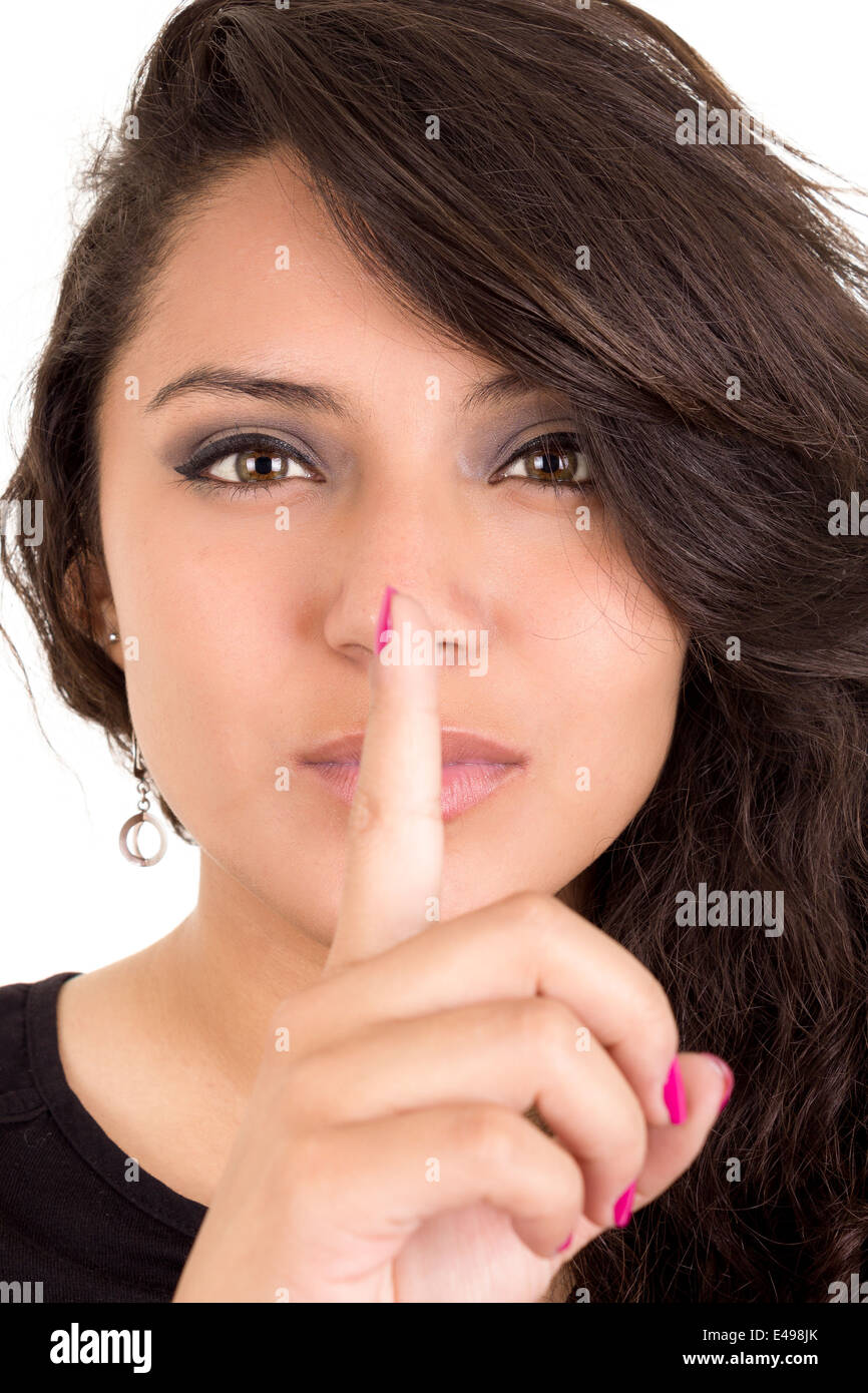 latin young girl giving the shhh expression Stock Photo - Alamy