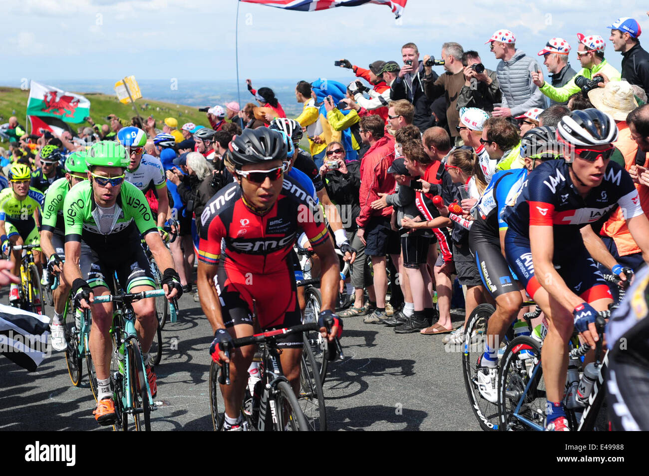 Holme Moss, Yorkshire, UK. 06th July 2014.Tour riders faced along haul ...