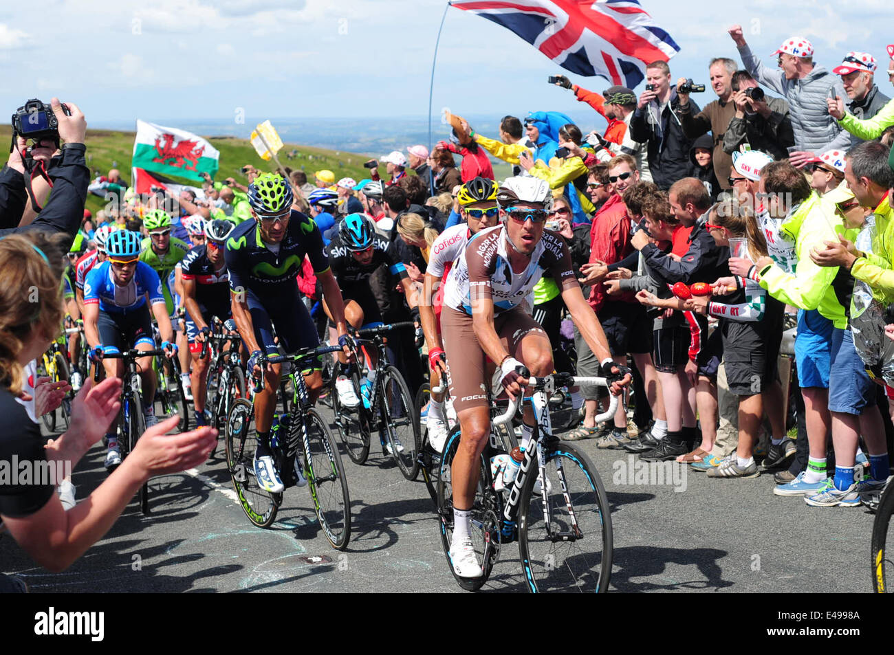 Holme Moss, Yorkshire, UK. 06th July 2014.Tour riders faced along haul ...