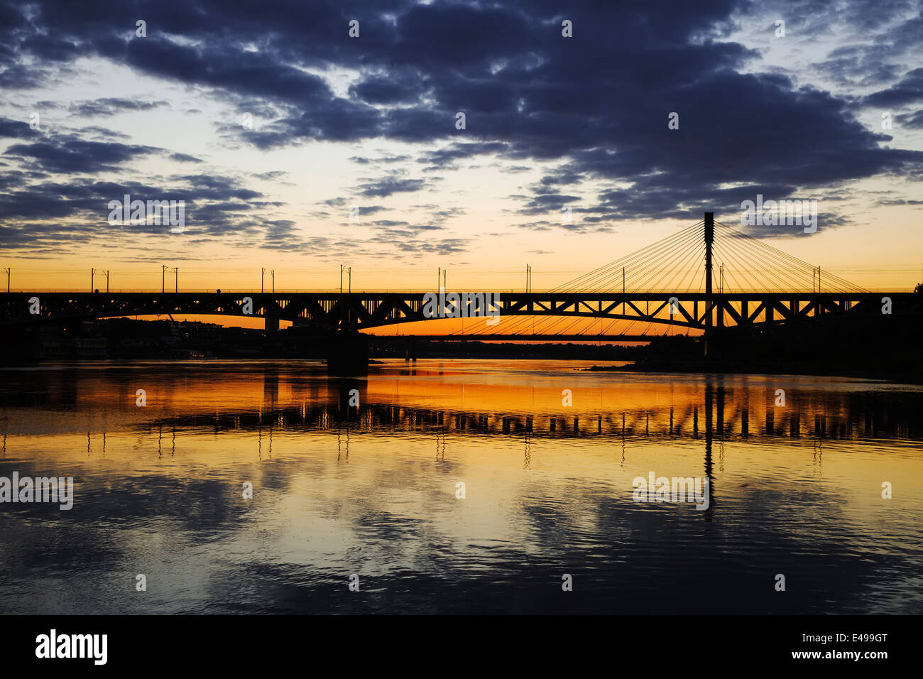 Bridge at night and reflected in the water. Swietokrzystki bridge Stock ...