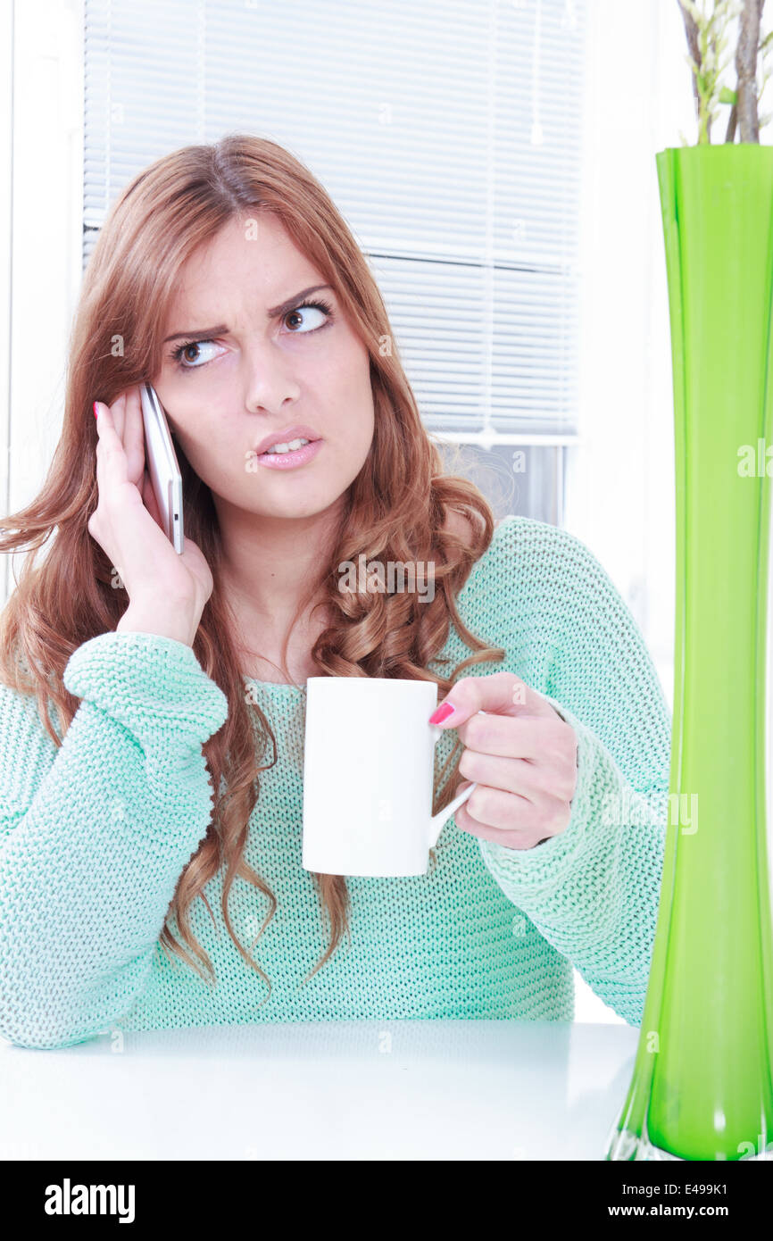 Worried Woman Receiving Bad News Over Phone Girl Holding Cup Of Coffee