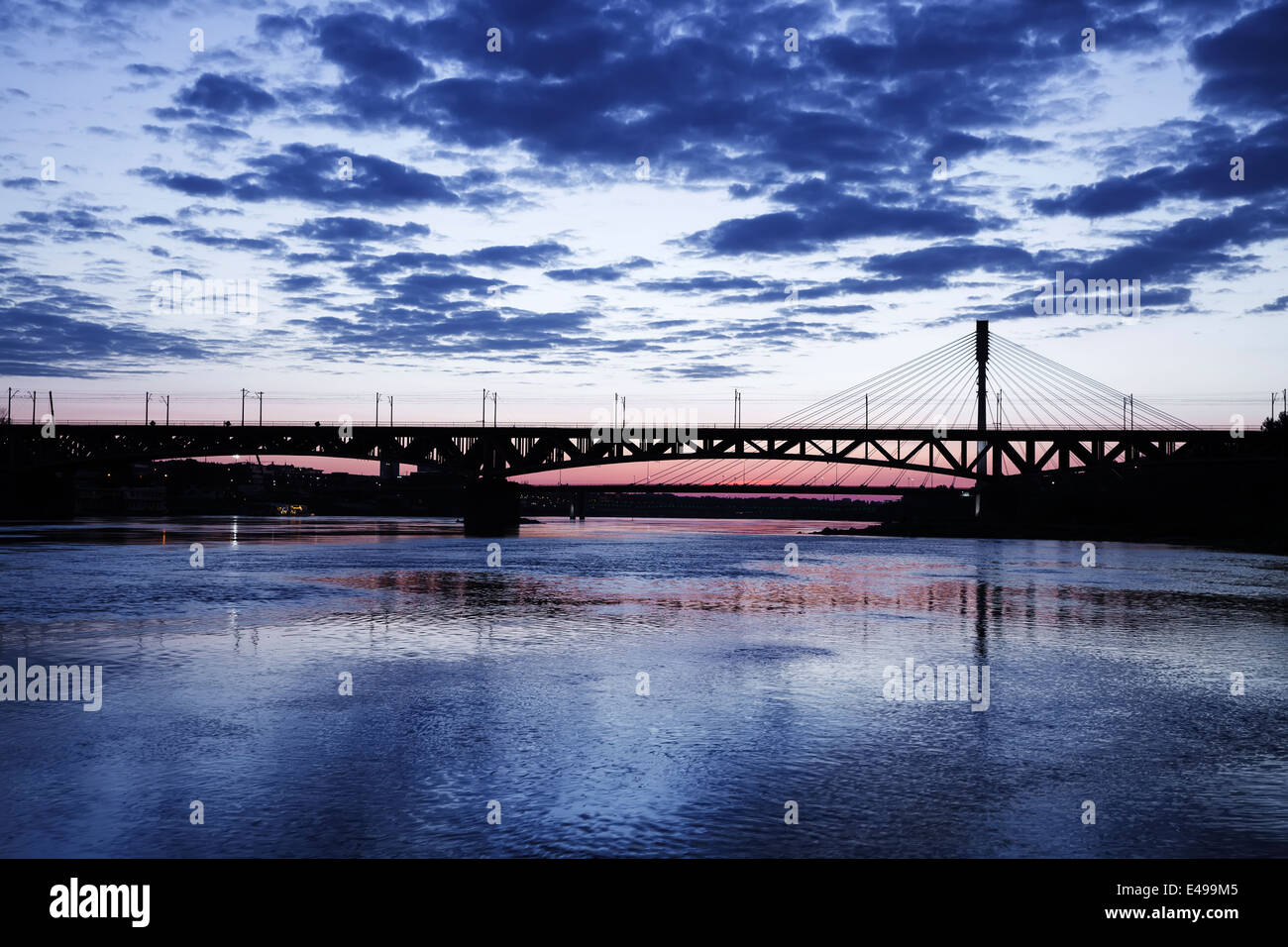 Bridge at night and reflected in the water. Swietokrzystki bridge Stock ...