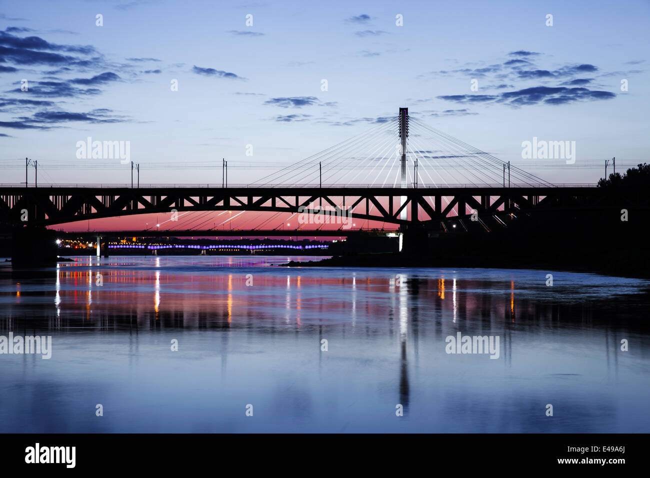 Bridge at night and reflected in the water. Swietokrzystki bridge Stock ...