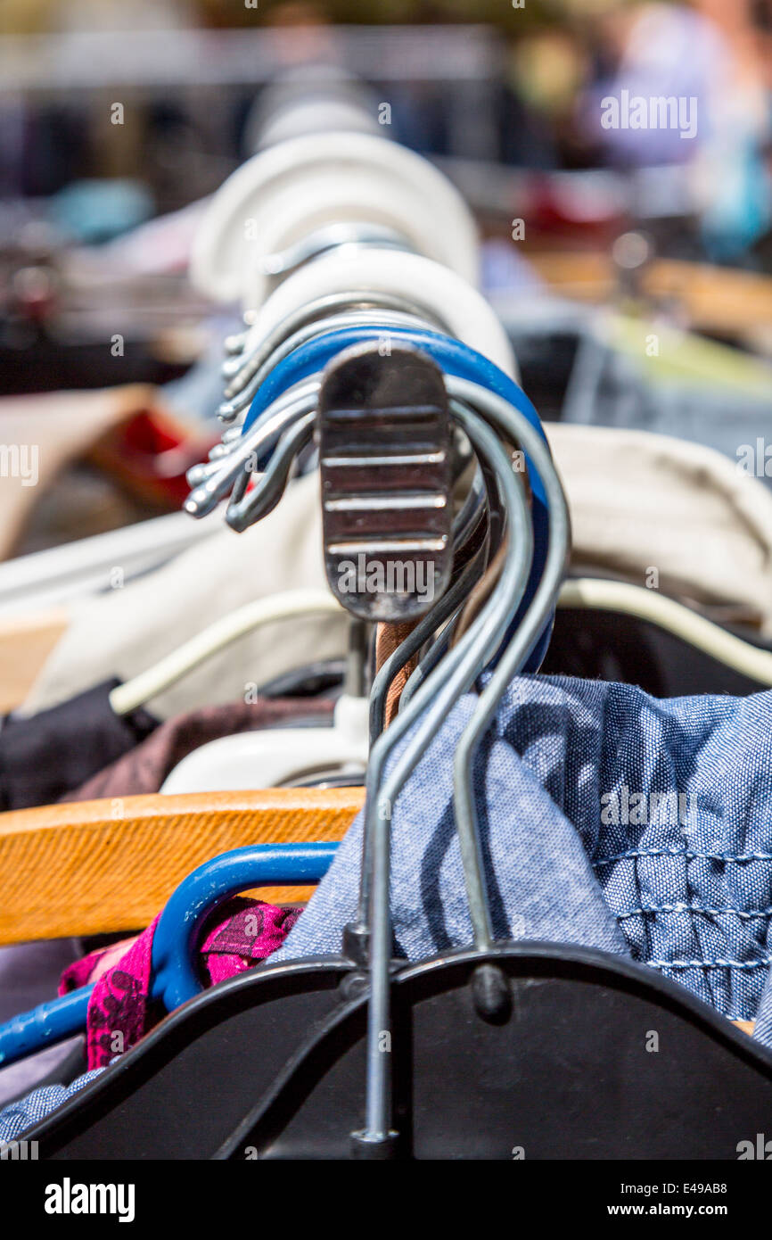 clothes on a rack on a flea market Stock Photo - Alamy