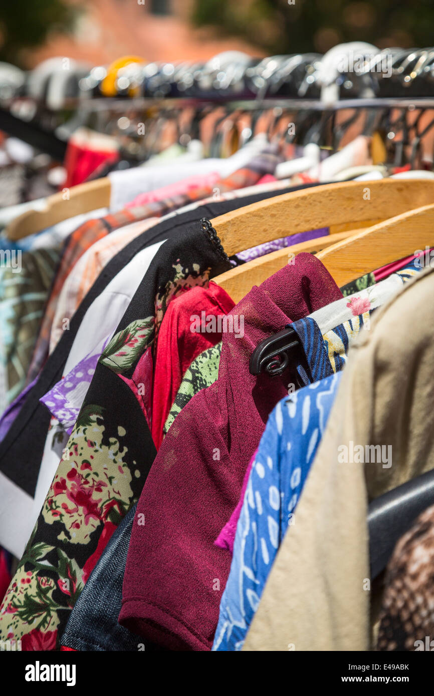 clothes on a rack on a flea market Stock Photo - Alamy