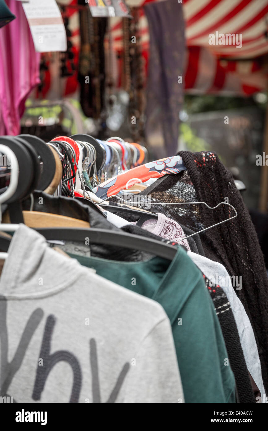 clothes on a rack on a flea market Stock Photo - Alamy