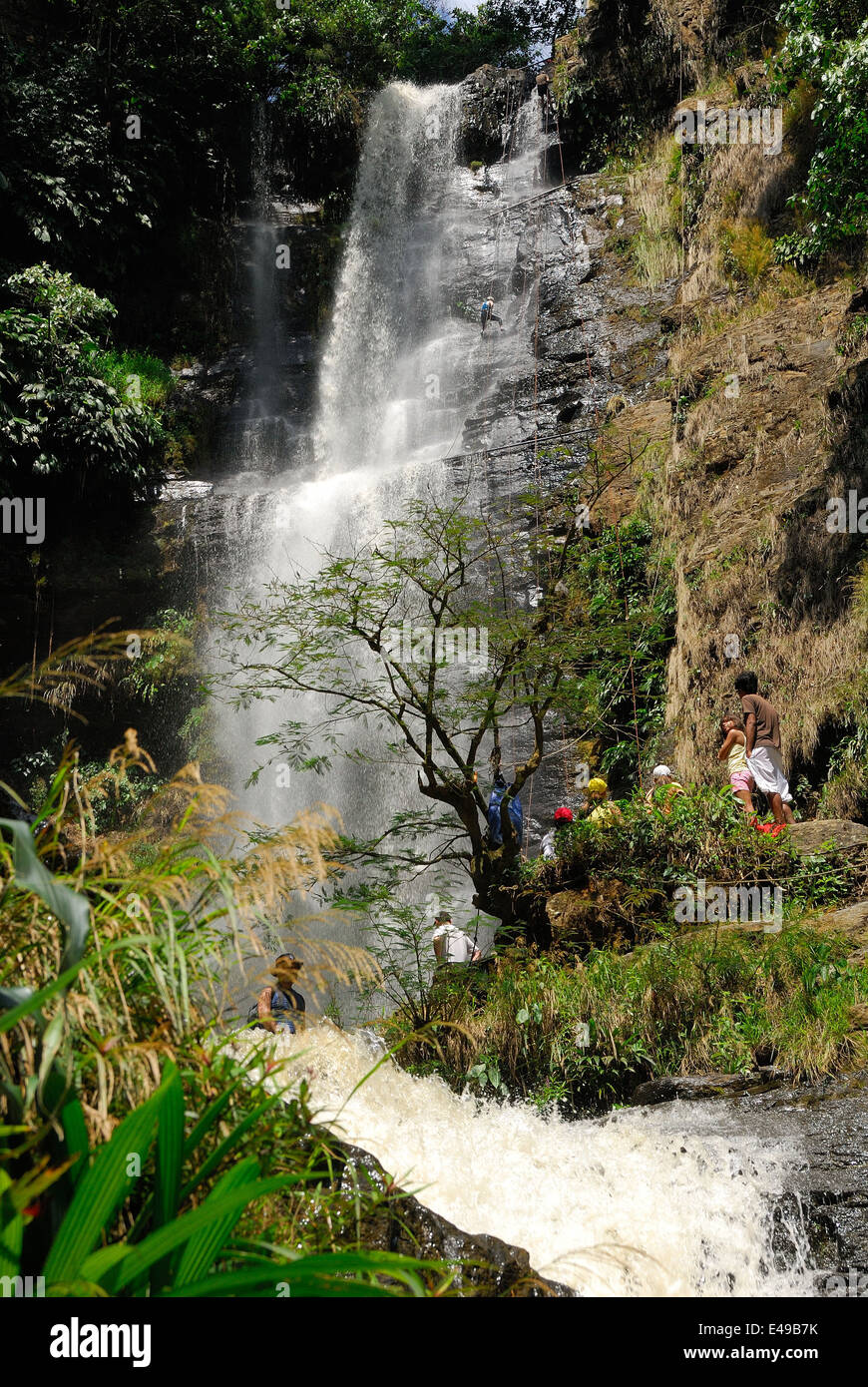 People climbing up and abseiling down the waterfall Stock Photo - Alamy